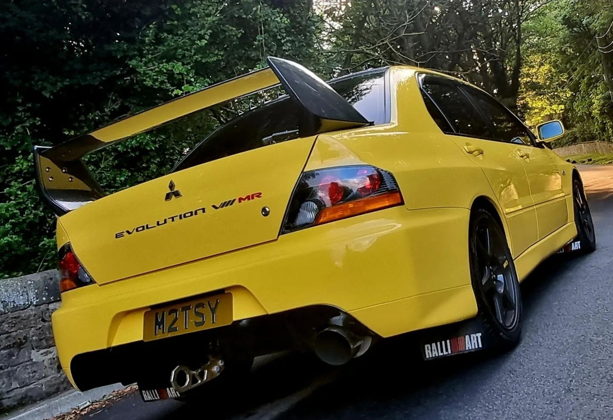 Yellow Mitsubishi Evo 8 with some tinted 3D gel plates – Crystal Plates